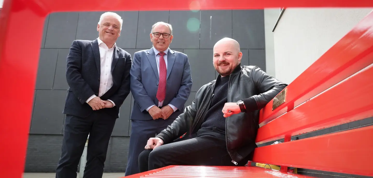 Iconic red bench unveiled at Queen's for Co. Down man who had ...